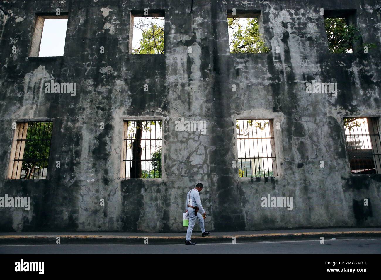 A Filipino security guard wearing a uniform of early civil guards ends ...