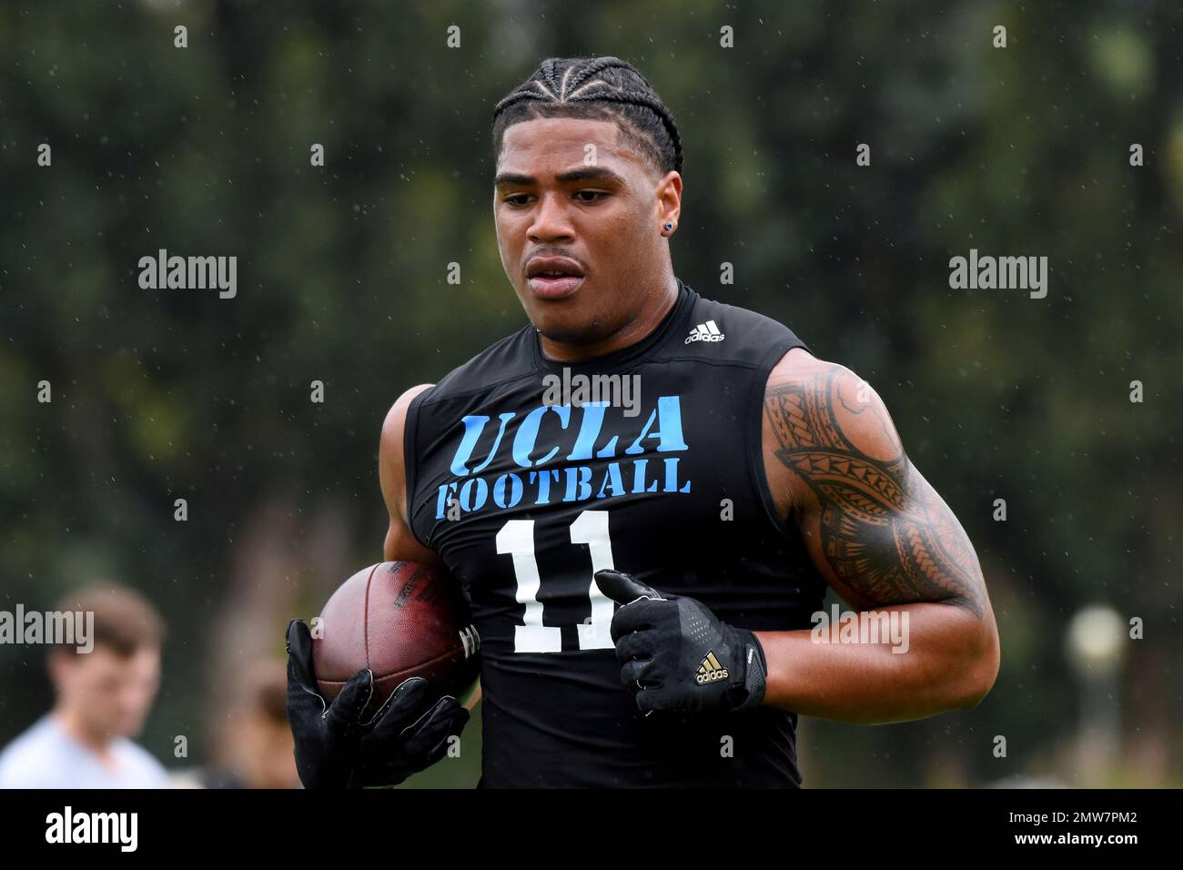 UCLA tight end and fullback Nate Iese runs upfield after a pass ...