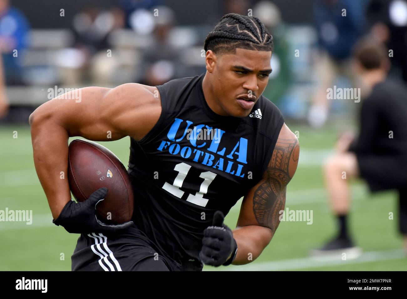 UCLA tight end and fullback Nate Iese turns upfield after catching a ...