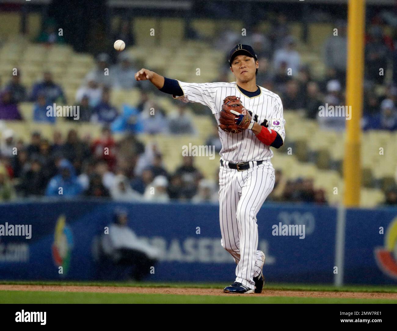 Japan's Hayato Sakamoto throws out United States' Andrew McCutchen at ...