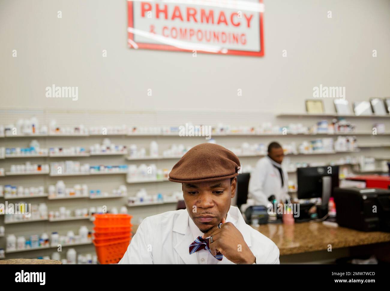Xavier Bryant, 33, an independent pharmacy owner, works at his pharmacy ...