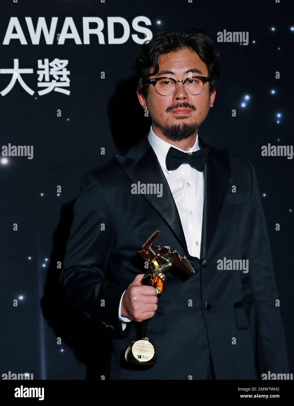 South Korea director Na Hong-jin poses after winning the Best Director ...