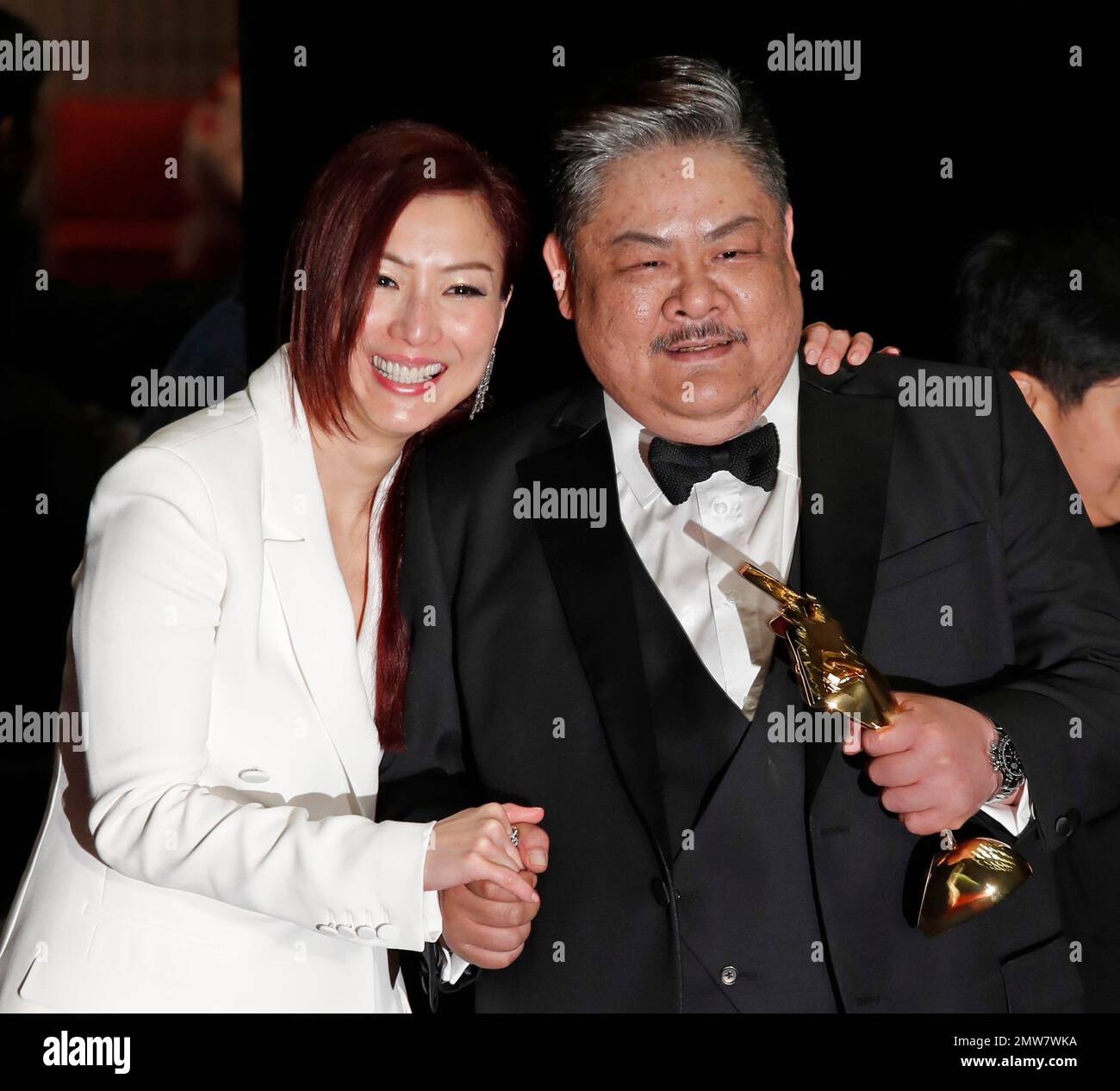 Hong Kong actress Sammi Cheng, left, and actor Lam Suet pose after ...