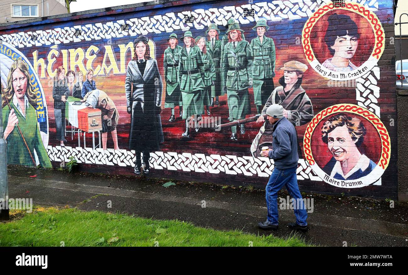 A man walks past a Republican mural in the bogside area of Londonderry ...
