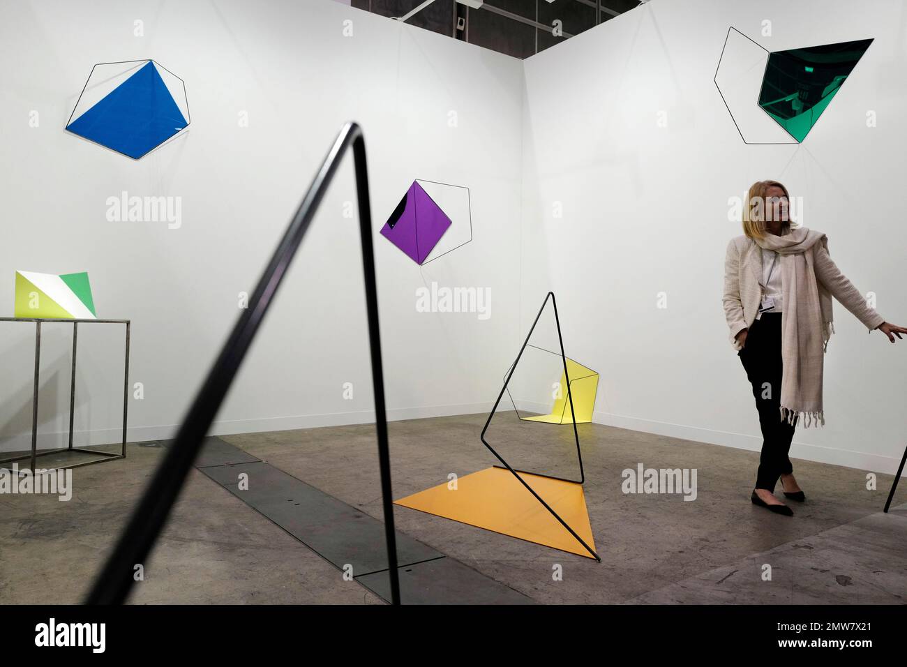 A woman stands beside the artwork created by Bangladeshi-British artist ...