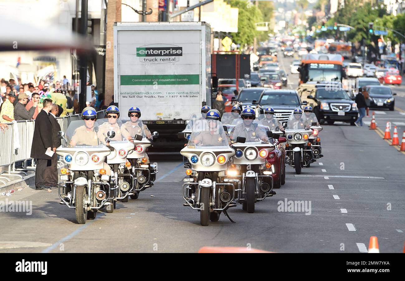 Actors dressed as police officers escort the stars of "CHIPS" at the ...