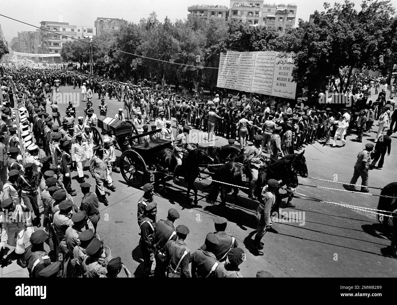 Gun carriage bearing the coffin of the former Shah of Iran turns toward ...