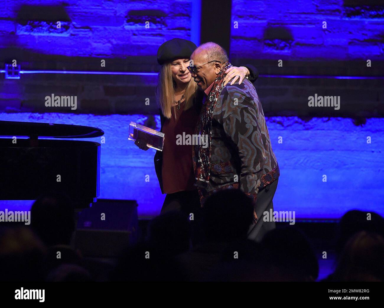 Barbra Streisand, left, presents the Distinction in Service award to ...