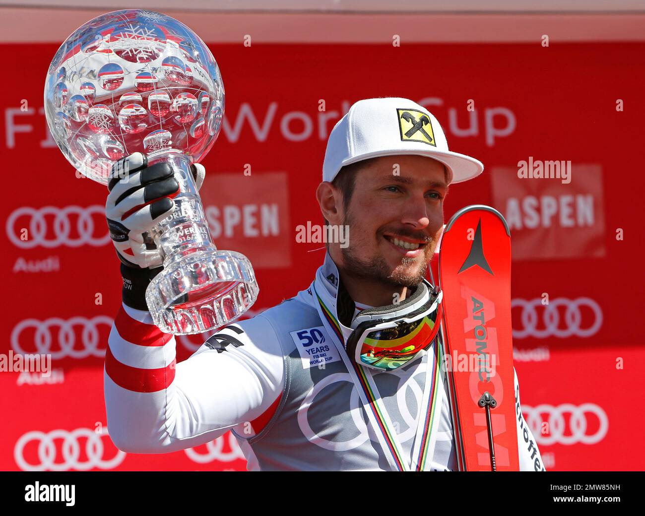 World Cup overall men's 2017 champion Austria's Marcel Hirscher holds a ...