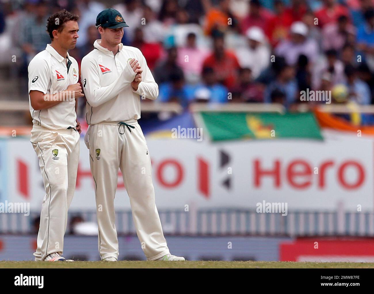 Australia's Steve O'Keefe, left, interacts with captain Steven Smith ...