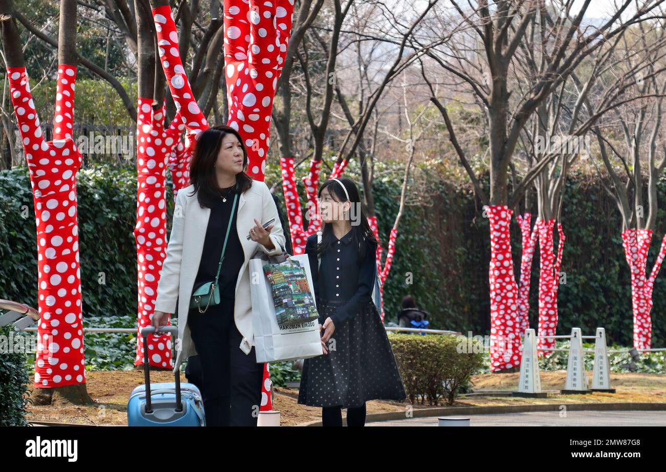 Visitors walk outside the New National Art Center where an exhibition ...