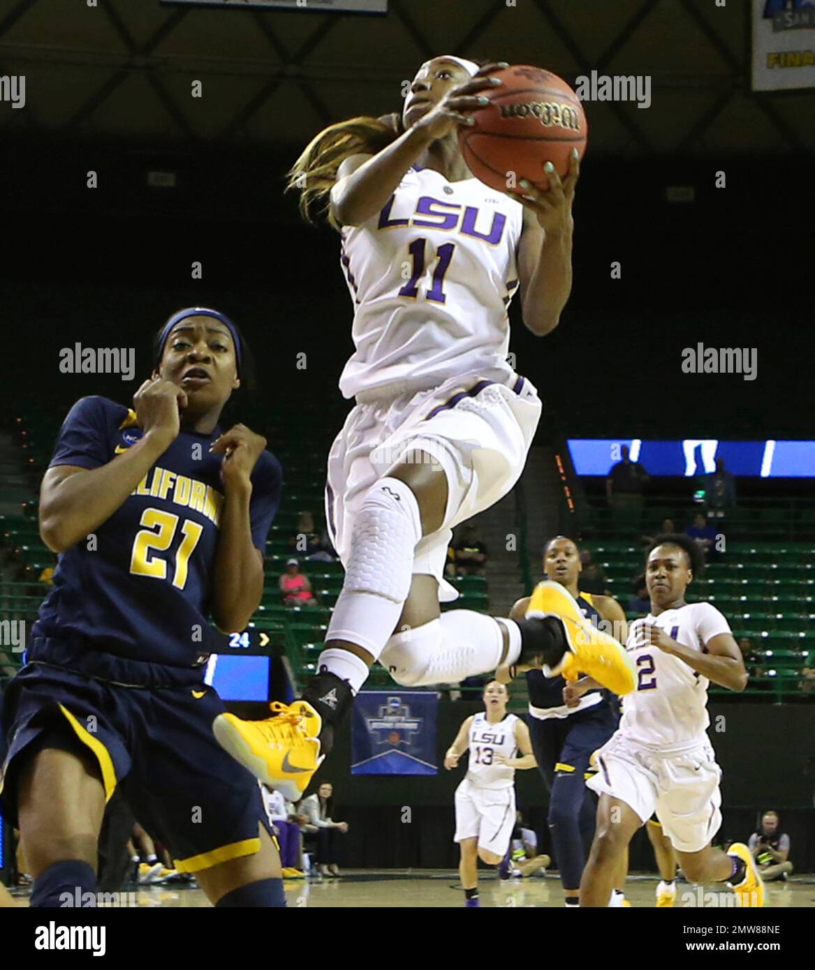 LSU guard Raigyne Moncrief (11) drives against California guard Mi'Cole Cayton (21) in the first ...