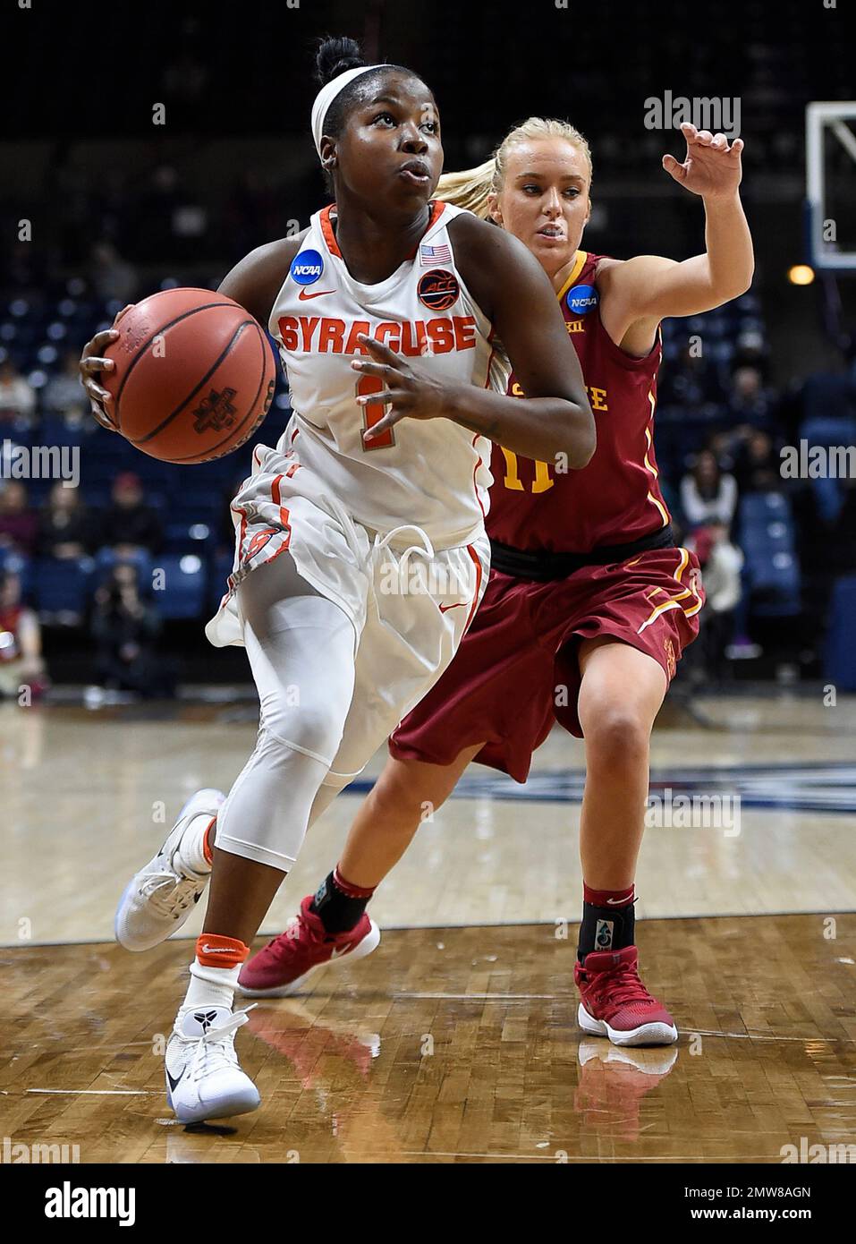 Syracuse's Alexis Peterson dribbles around Iowa State's Jadda Buckley ...