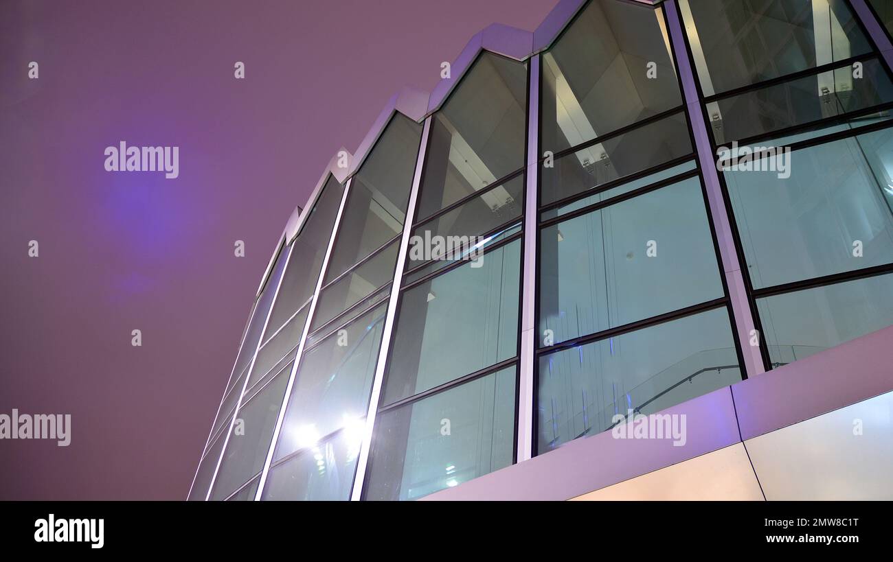 Corporate building at night - business concept. Glass wall office ...