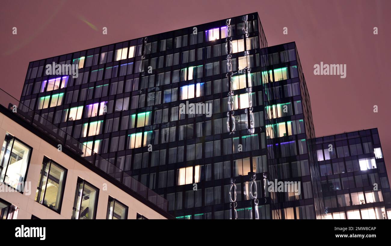 Corporate building at night - business concept. Glass wall office ...