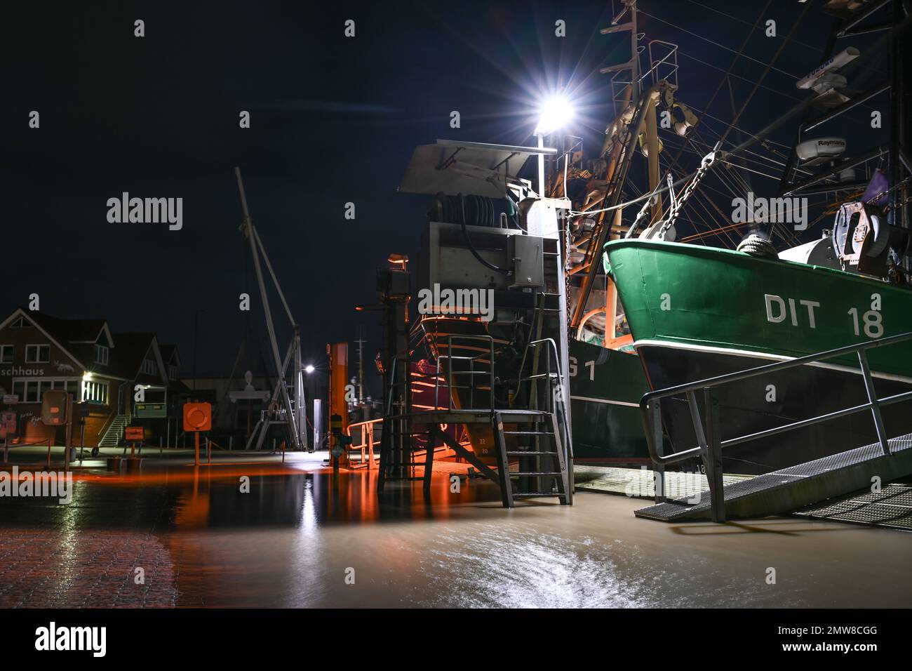 01 February 2023, Lower Saxony, Ditzum: Cutters lie in the harbor at ...