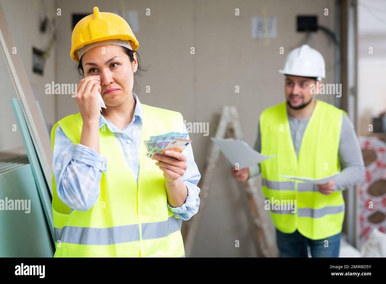 Woman engineer crying, disappointed by low salary Stock Photo - Alamy