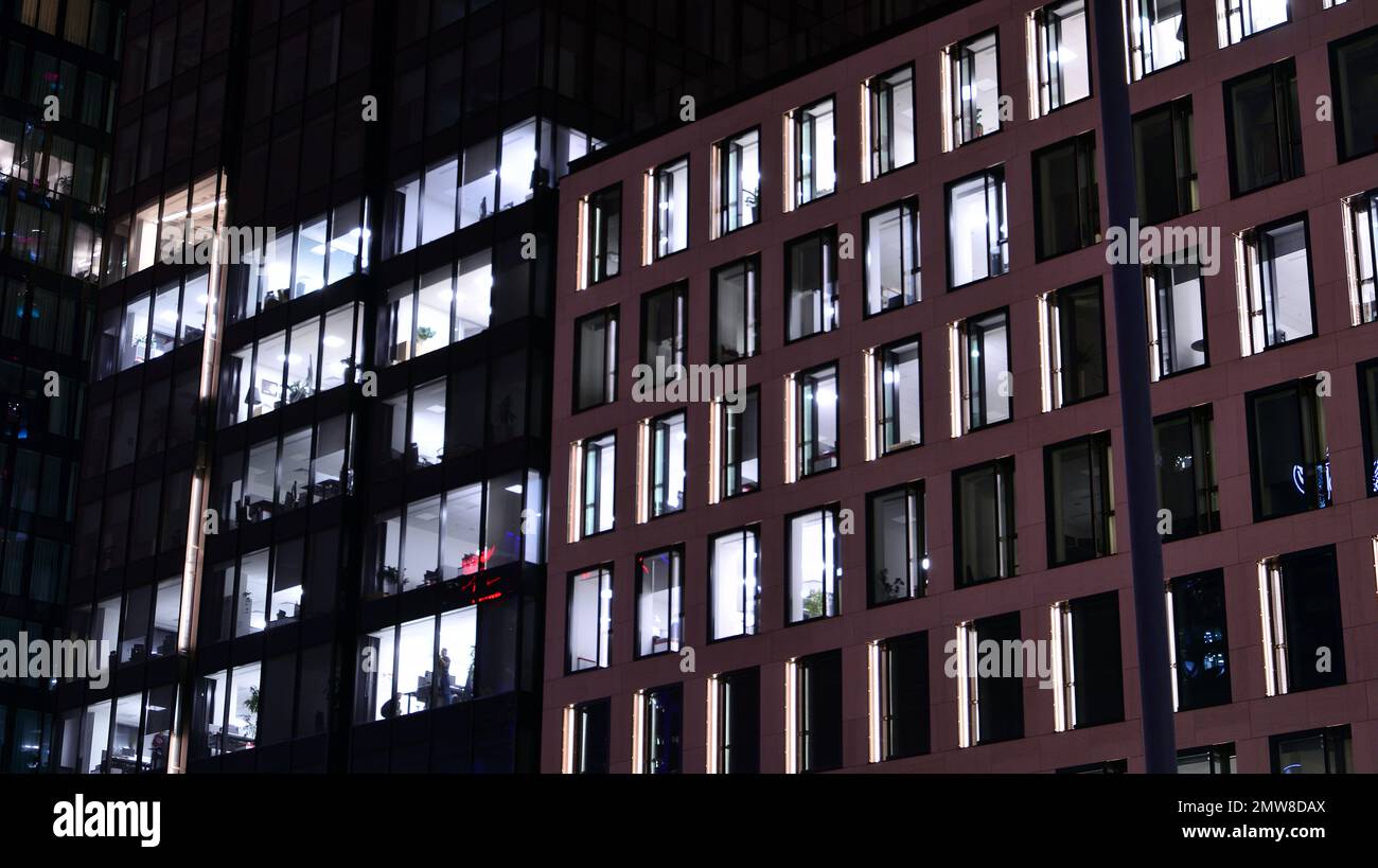 Corporate building at night - business concept. Glass wall office ...