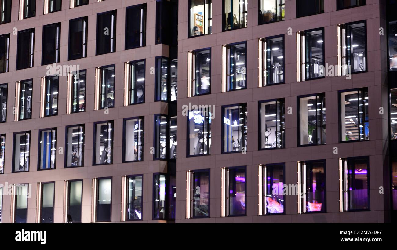 Corporate building at night - business concept. Glass wall office ...