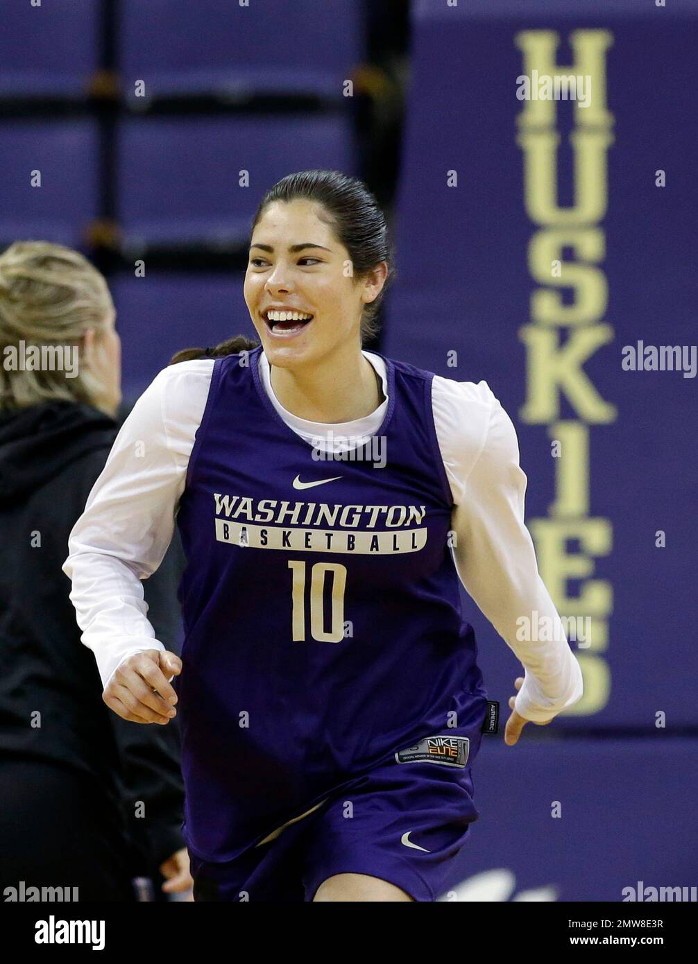 Washington's Kelsey Plum smiles as she runs up court at a practice a ...