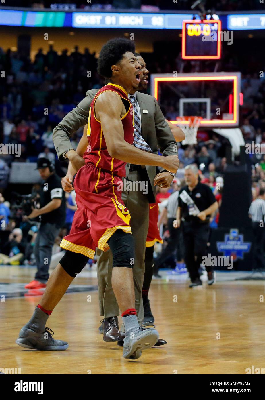 Southern California's Elijah Stewart celebrates with team staff after ...
