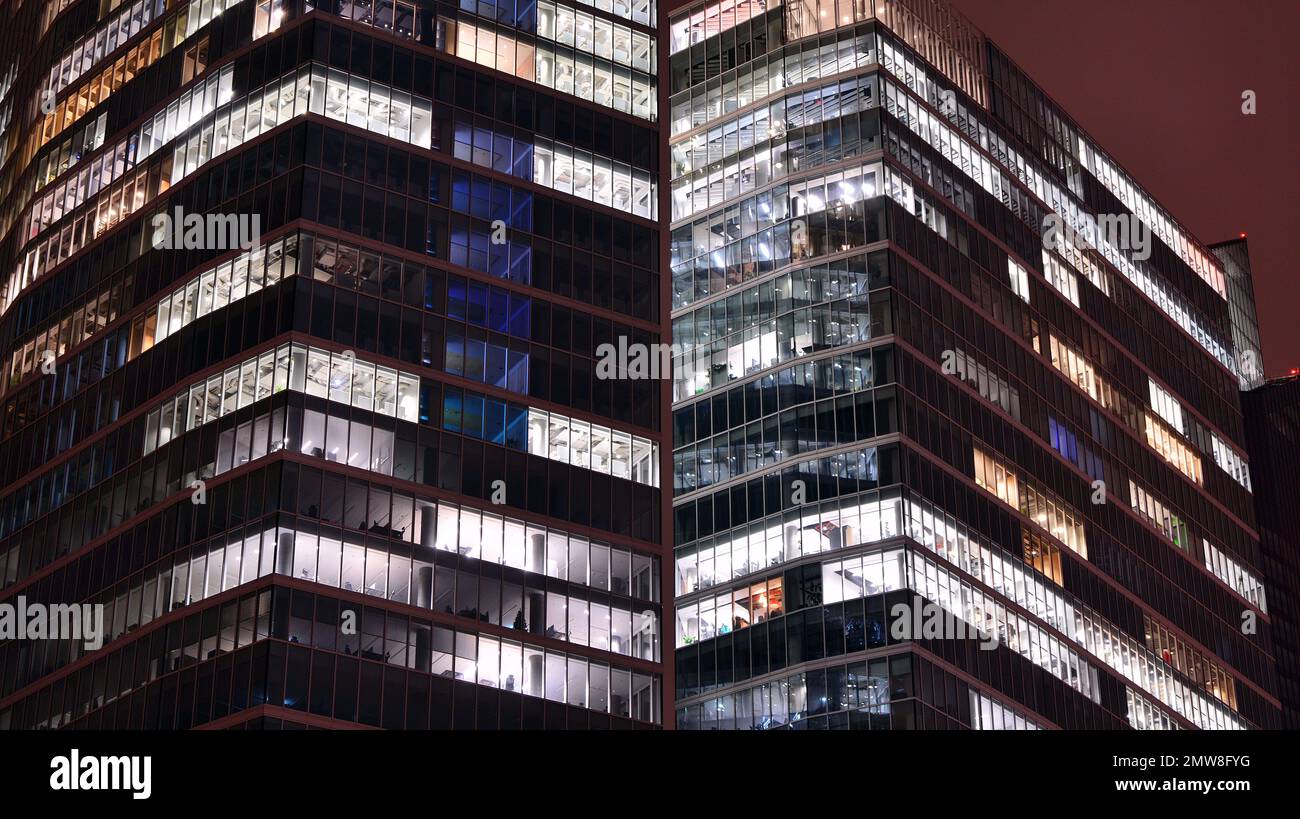 Corporate building at night - business concept. Glass wall office ...