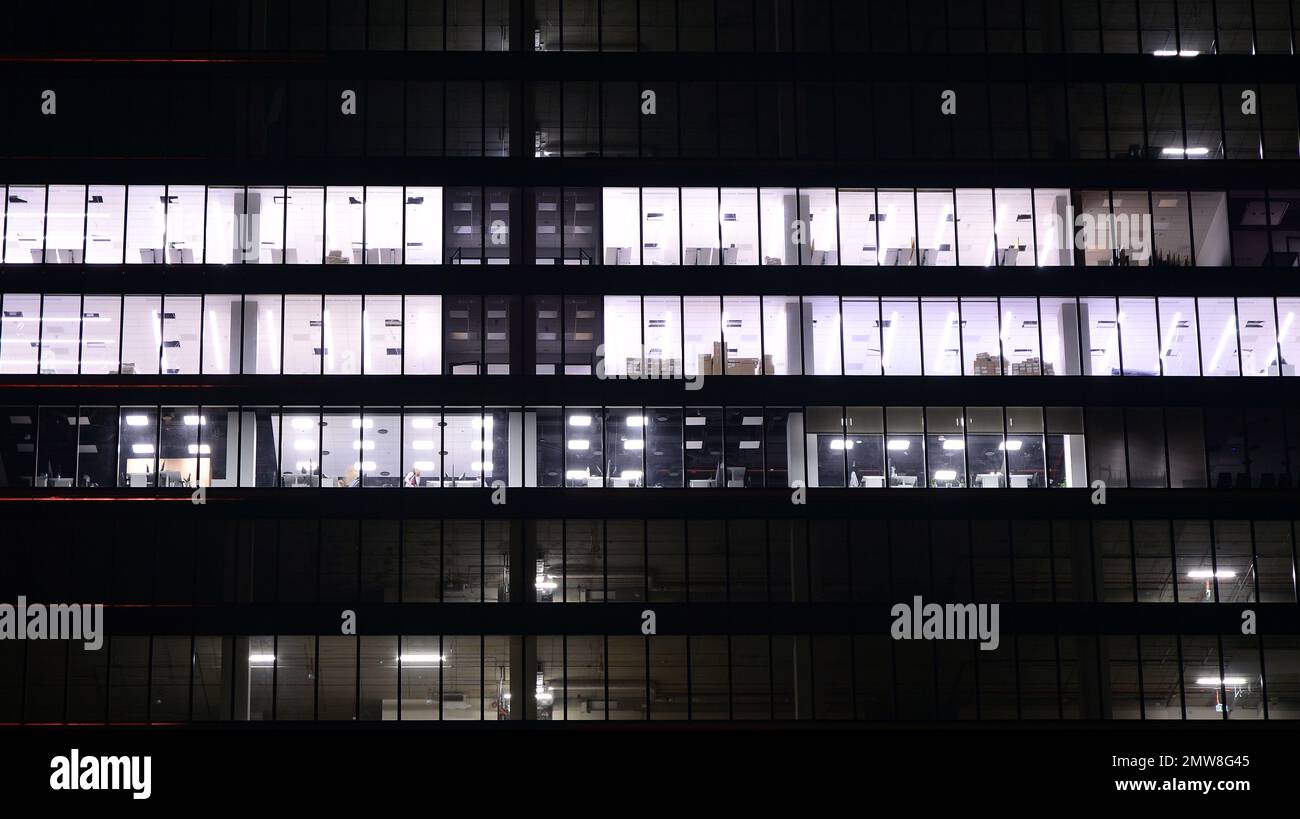Corporate building at night - business concept. Glass wall office ...