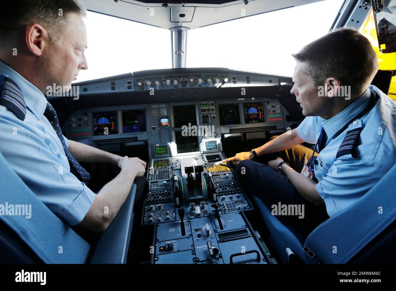 Pilots Andrew Brixner, right, and David Dishman explain some features ...