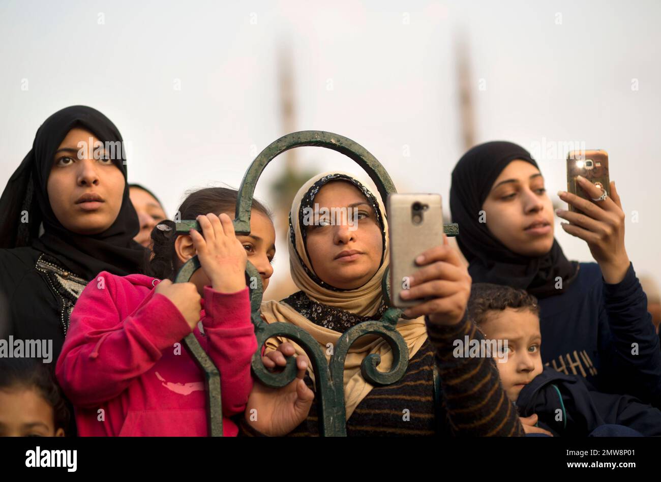 People watch and film Moulid Al-Rifa'i, a Sufi gathering which ...