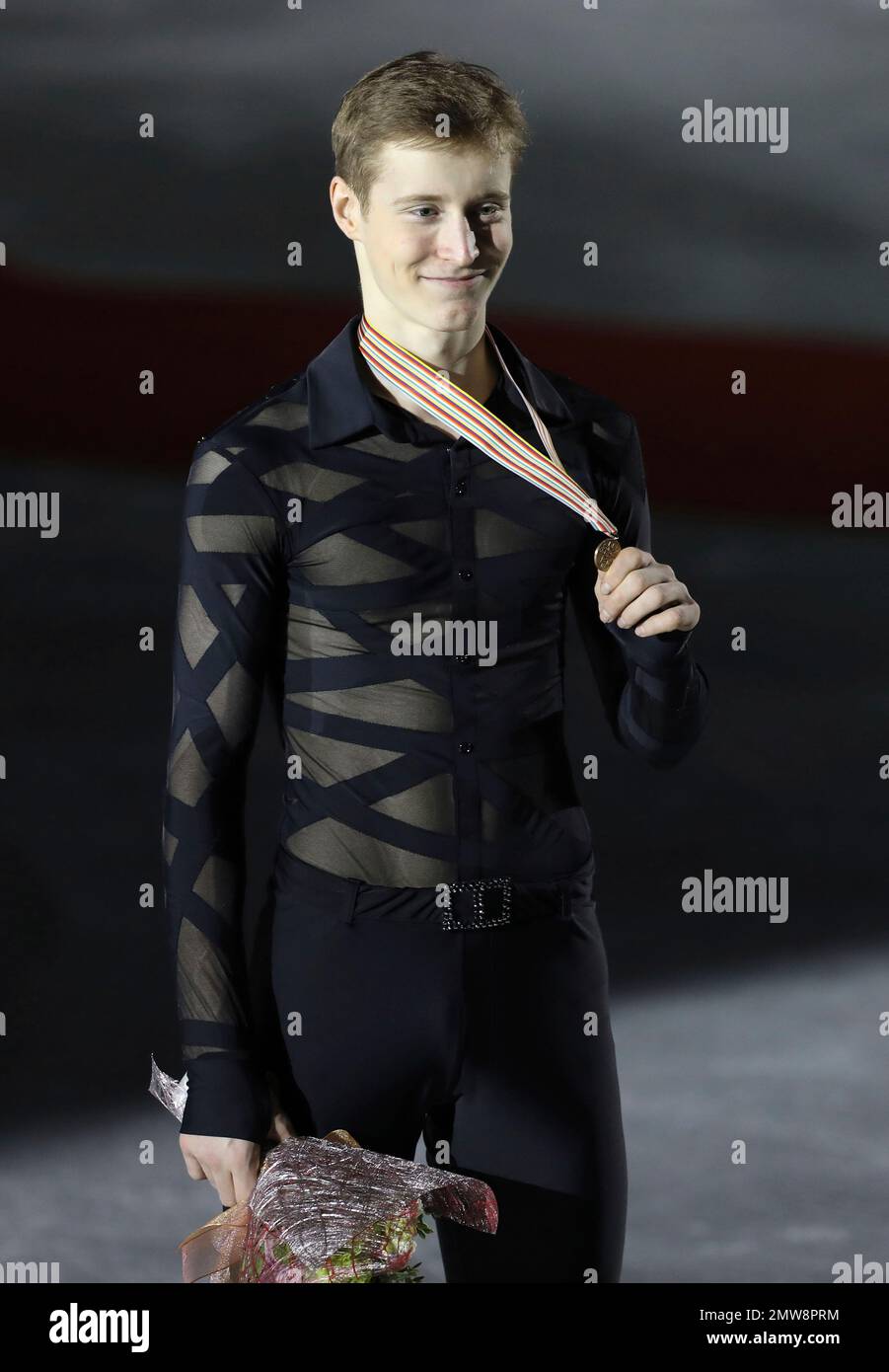 Alexander Samarin of Russia with bronze poses after completing the Men ...