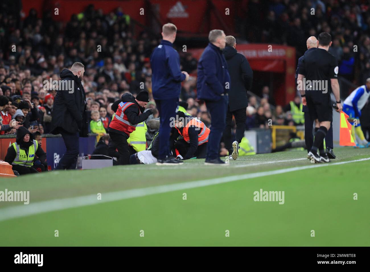 A pitch invader is caught close to the touchline during the Carabao Cup ...