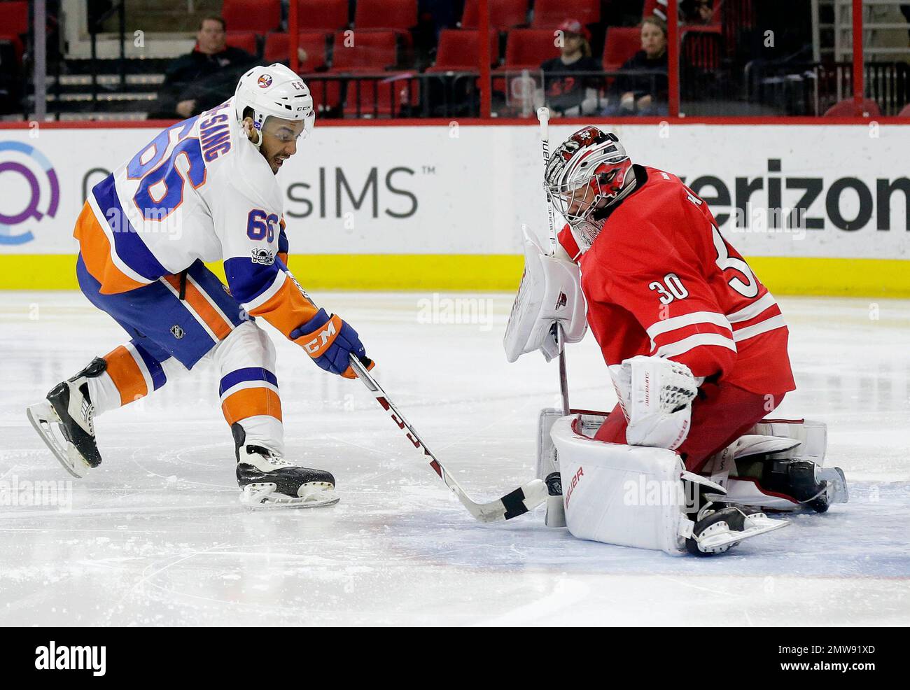 New York Islanders' Joshua Ho-Sang is blocked by Carolina Hurricanes ...