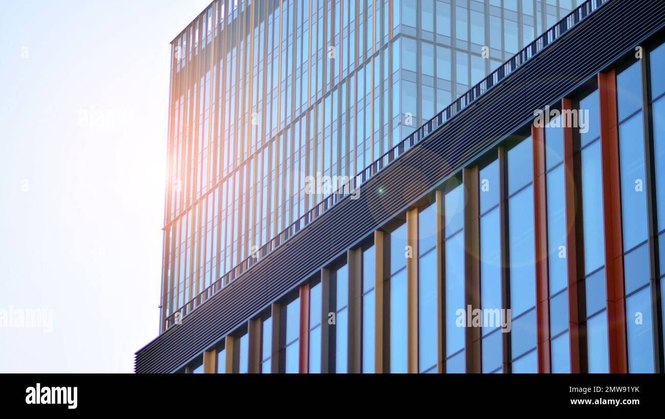 Abstract closeup of the glass-clad facade of a modern building covered ...