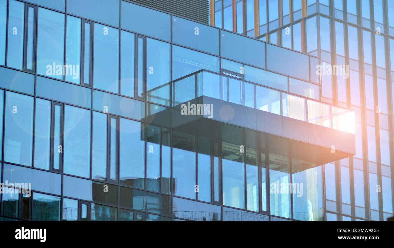 Abstract closeup of the glass-clad facade of a modern building covered ...