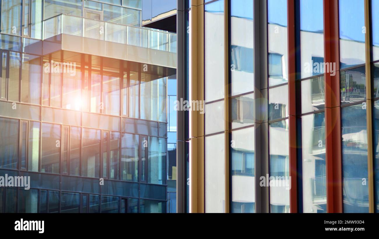 Abstract closeup of the glass-clad facade of a modern building covered ...