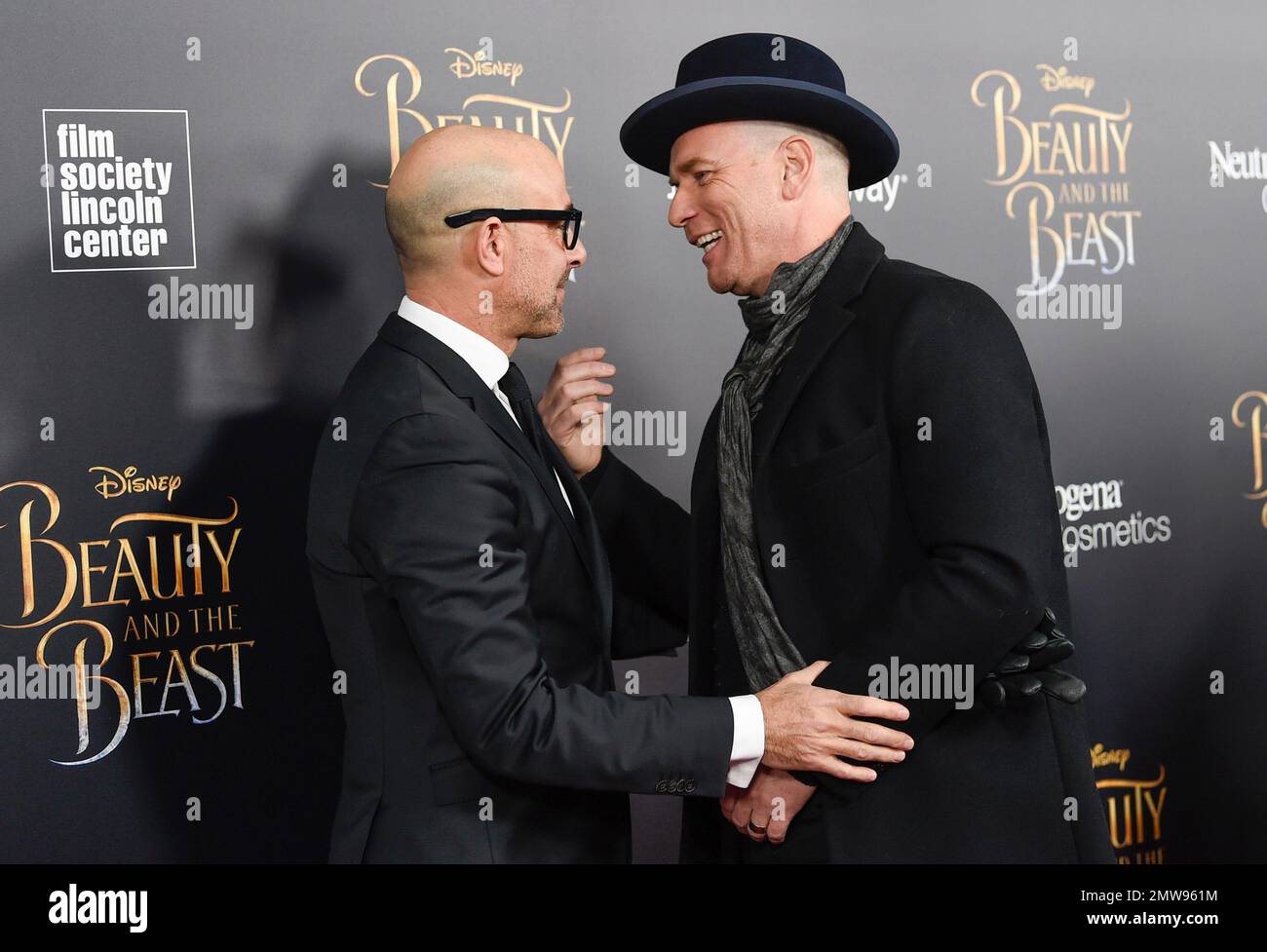 Actors Stanley Tucci, left, and Ewan McGregor greet each other at a ...