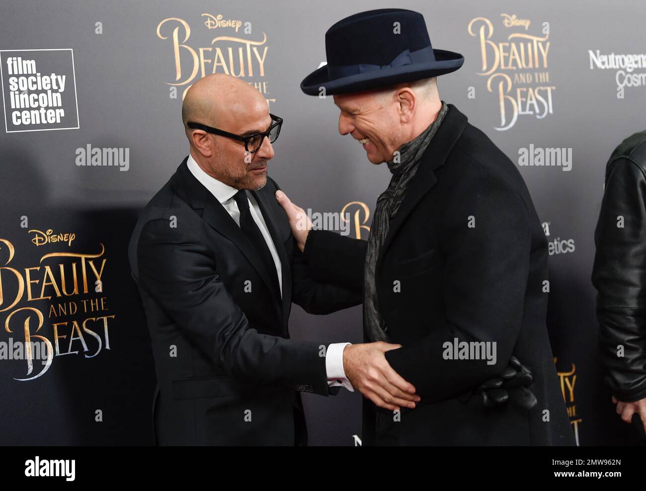Actors Stanley Tucci, left, and Ewan McGregor greet each other at a ...