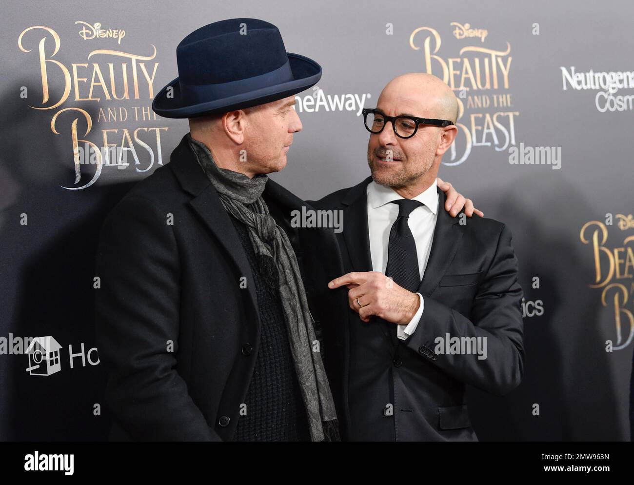 Actors Stanley Tucci, left, and Ewan McGregor greet each other at a ...