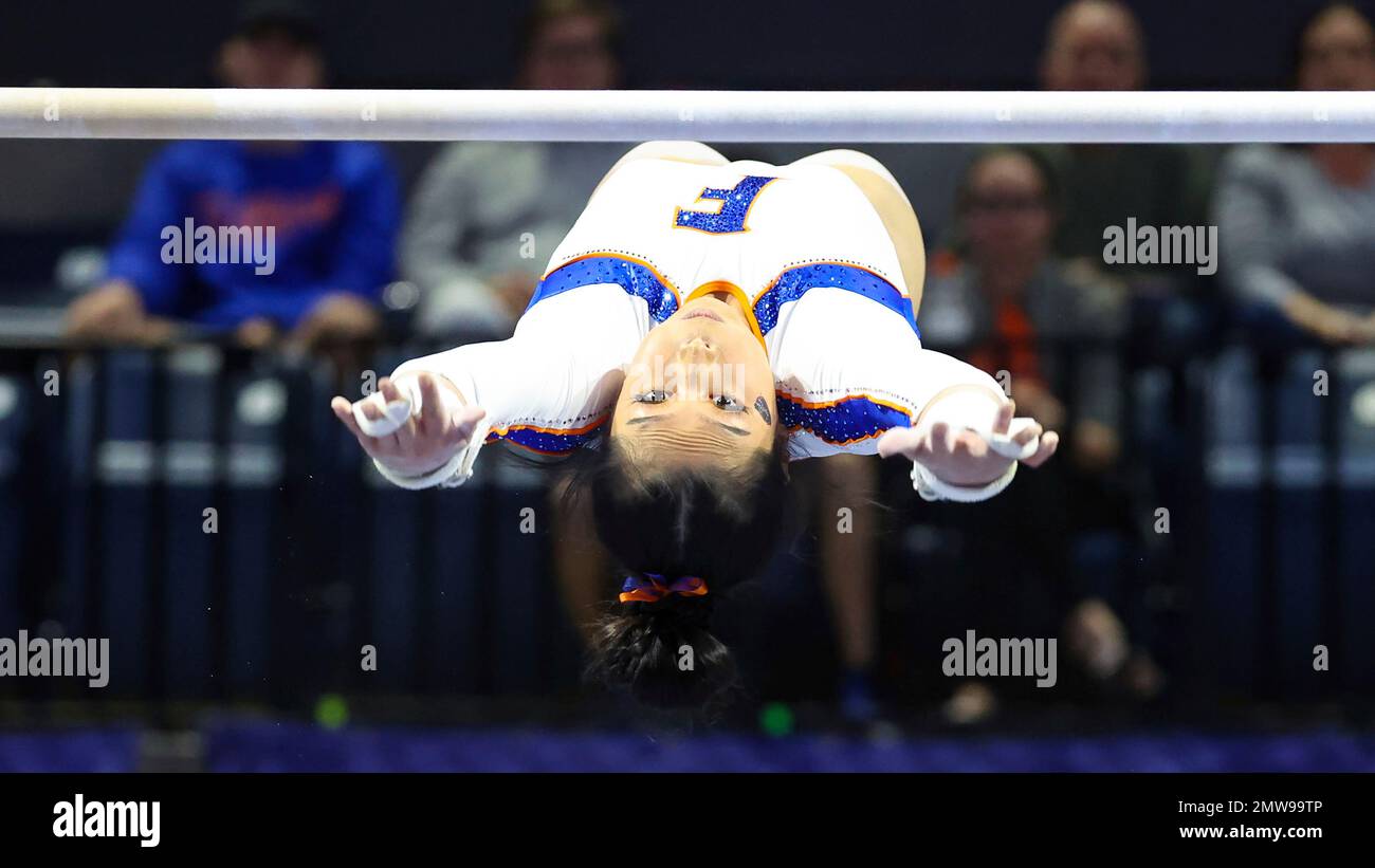 Florida's Victoria Nguyen competes on the uneven bars during an NCAA ...