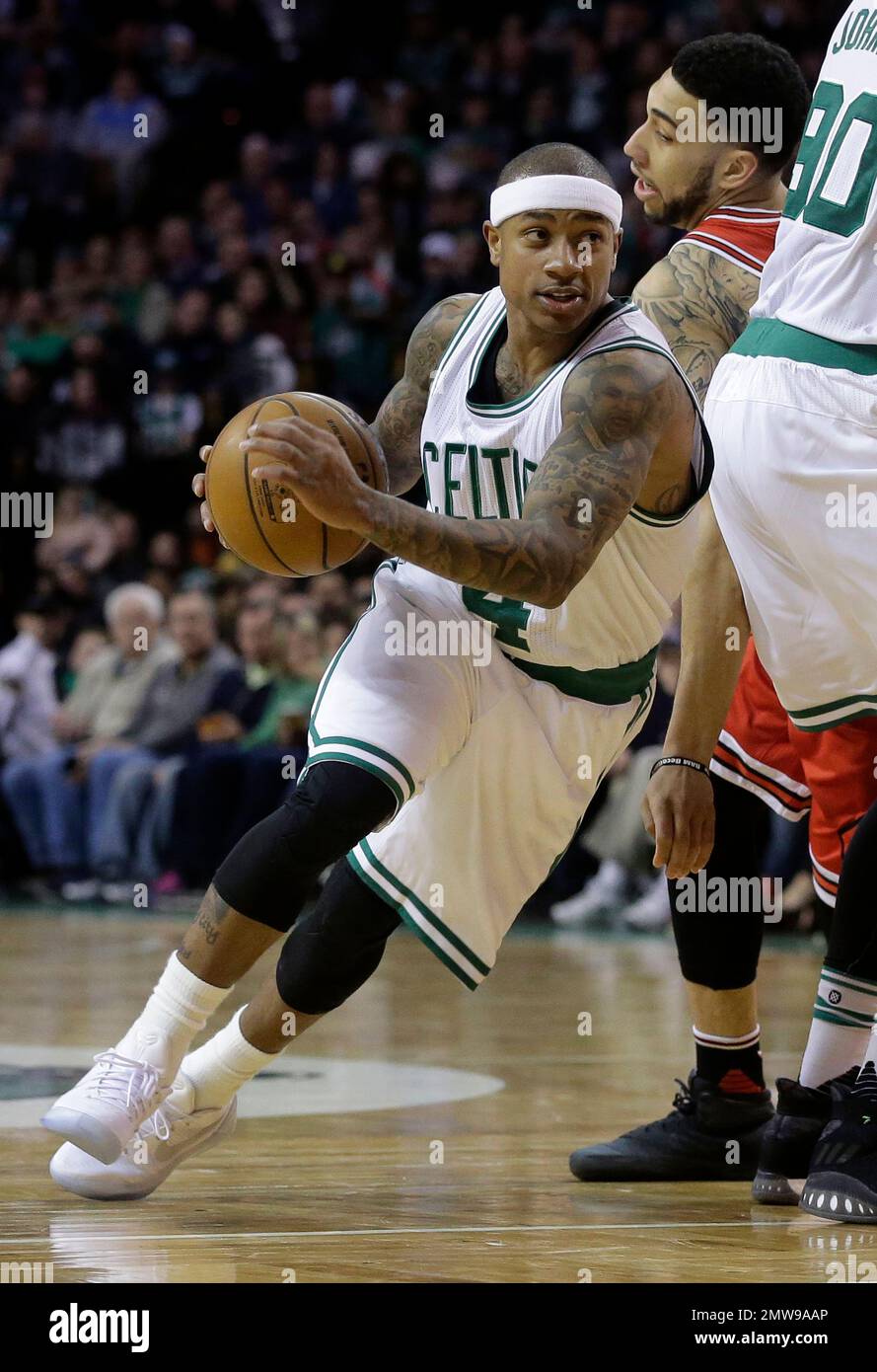 Boston Celtics guard Isaiah Thomas, left, is pursued by Chicago Bulls ...