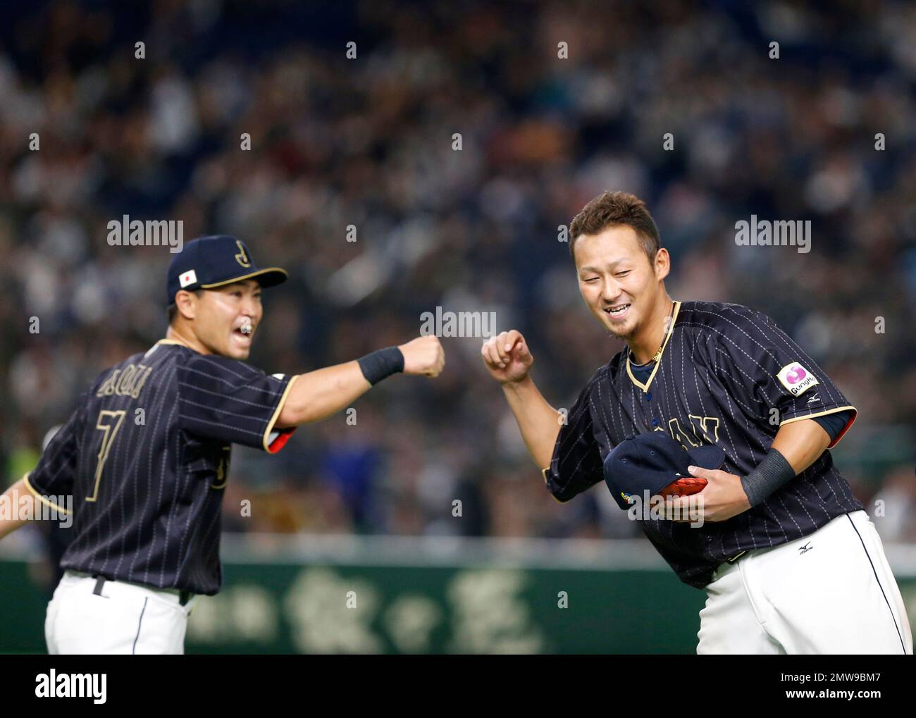 Japan's Sho Nakata, right, celebrates with teammate Norichika Aoki ...