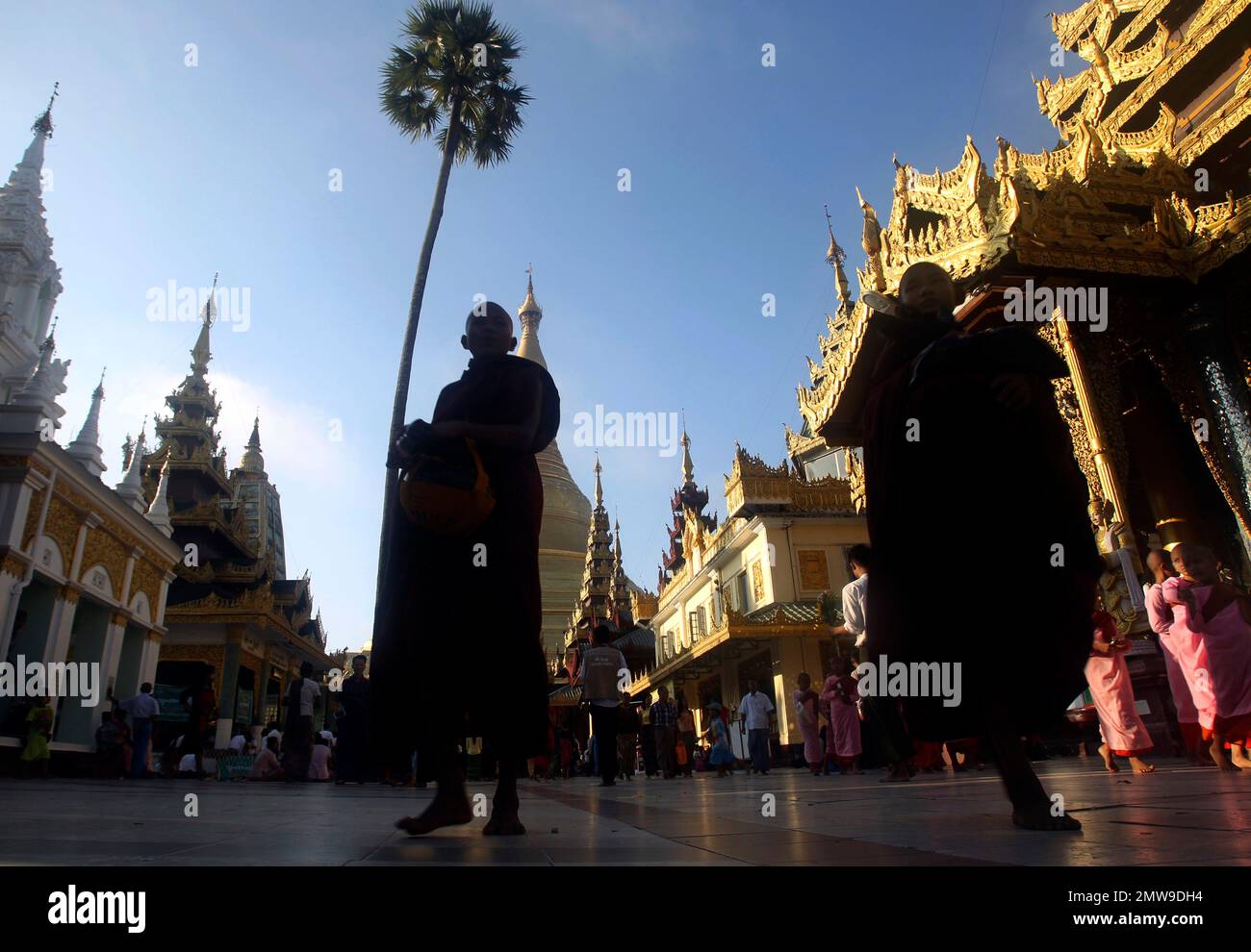 Two Buddhist novice monks walks to collect alms from devotees at ...