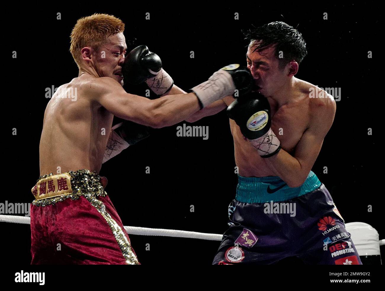 Hong Kong fighter Rex Tso, right, fights with Japanese fighter Hirofumi ...