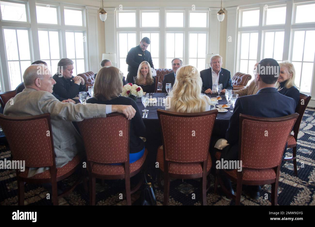 President Donald Trump, back right, meets, from left clockwise ...