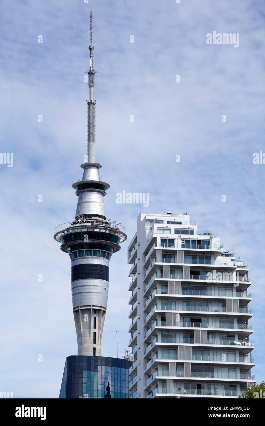 The view of residential building with a tall futuristic tower behind in ...
