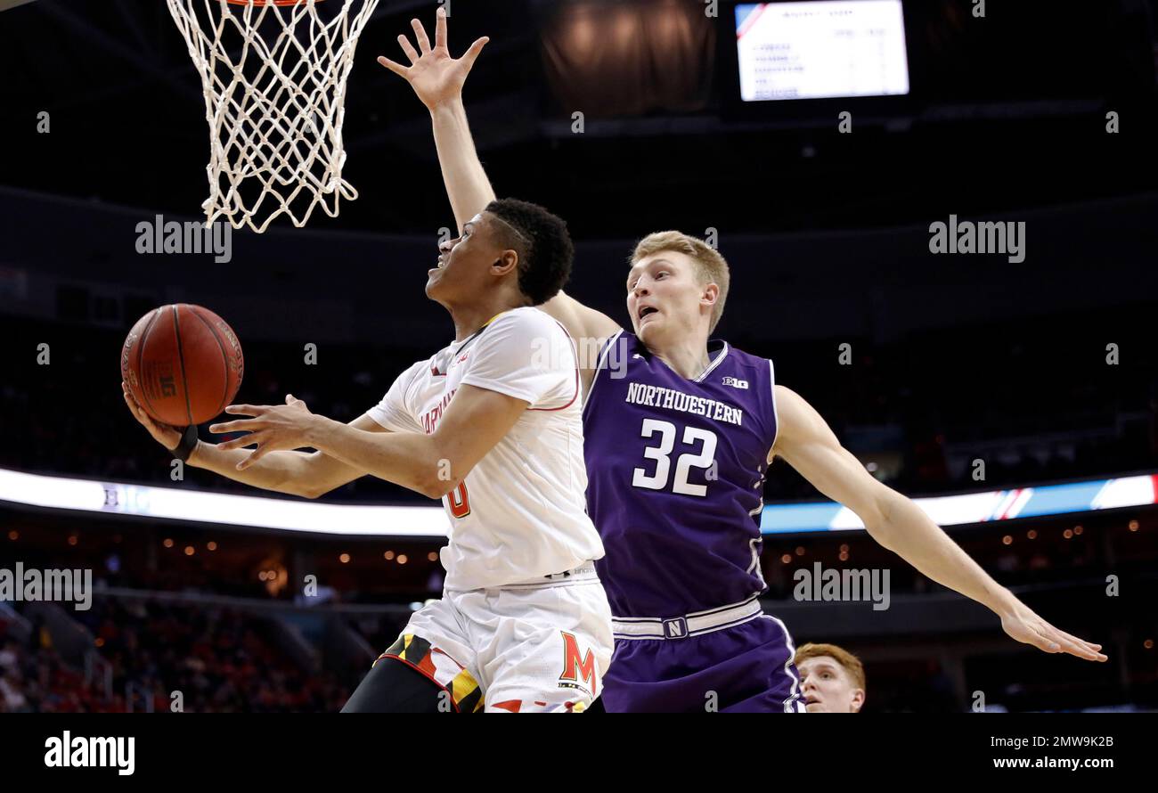 Maryland guard Anthony Cowan (0) shoots in front of Northwestern ...
