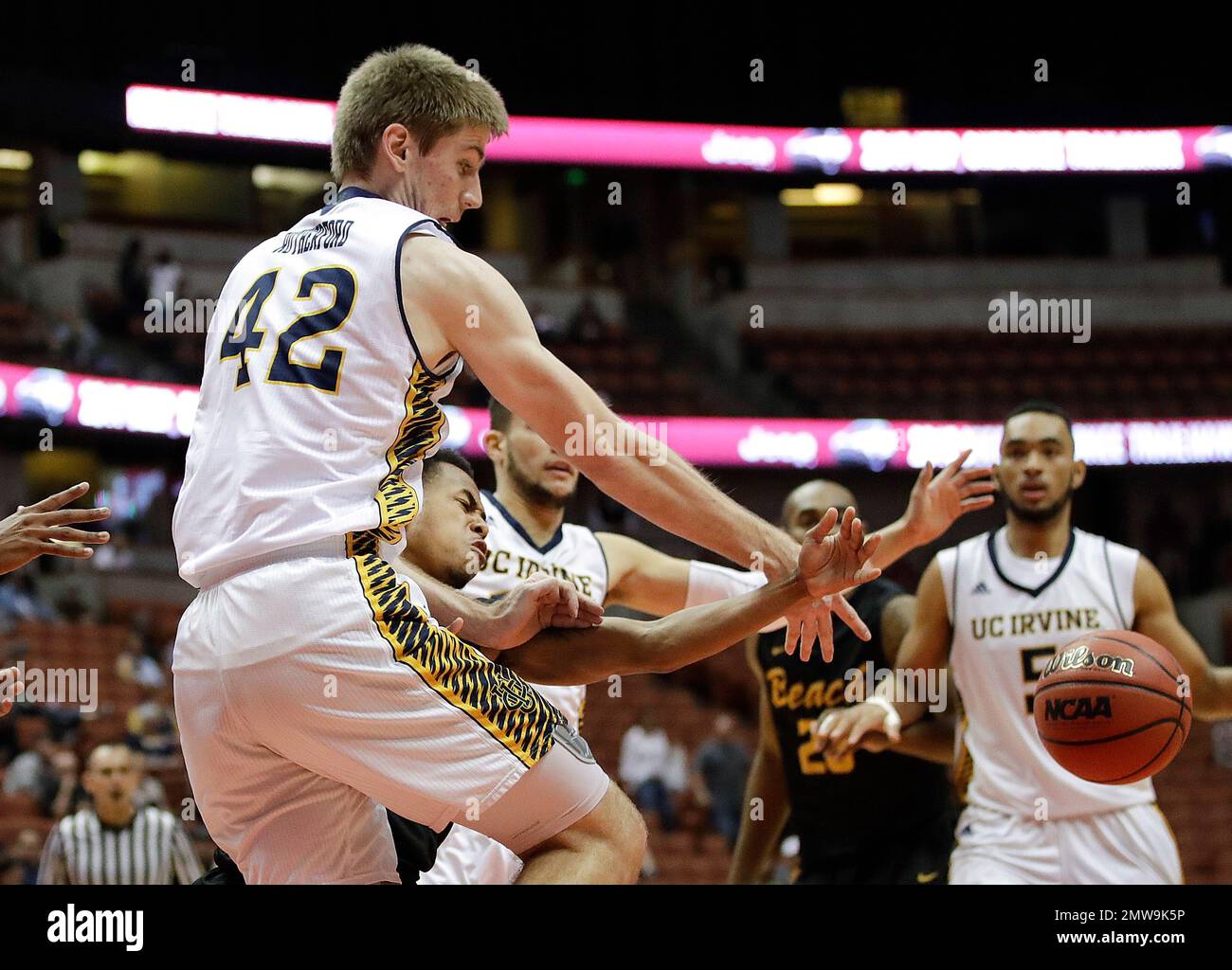 UC Irvine's Tommy Rutherford, front, defends Long Beach State's Justin ...