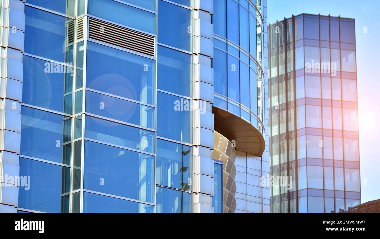 Abstract closeup of the glass-clad facade of a modern building covered ...
