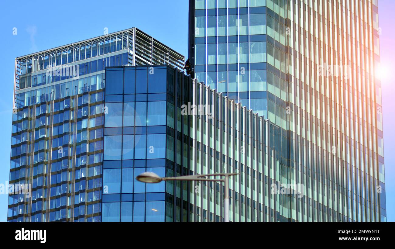 Abstract closeup of the glass-clad facade of a modern building covered ...