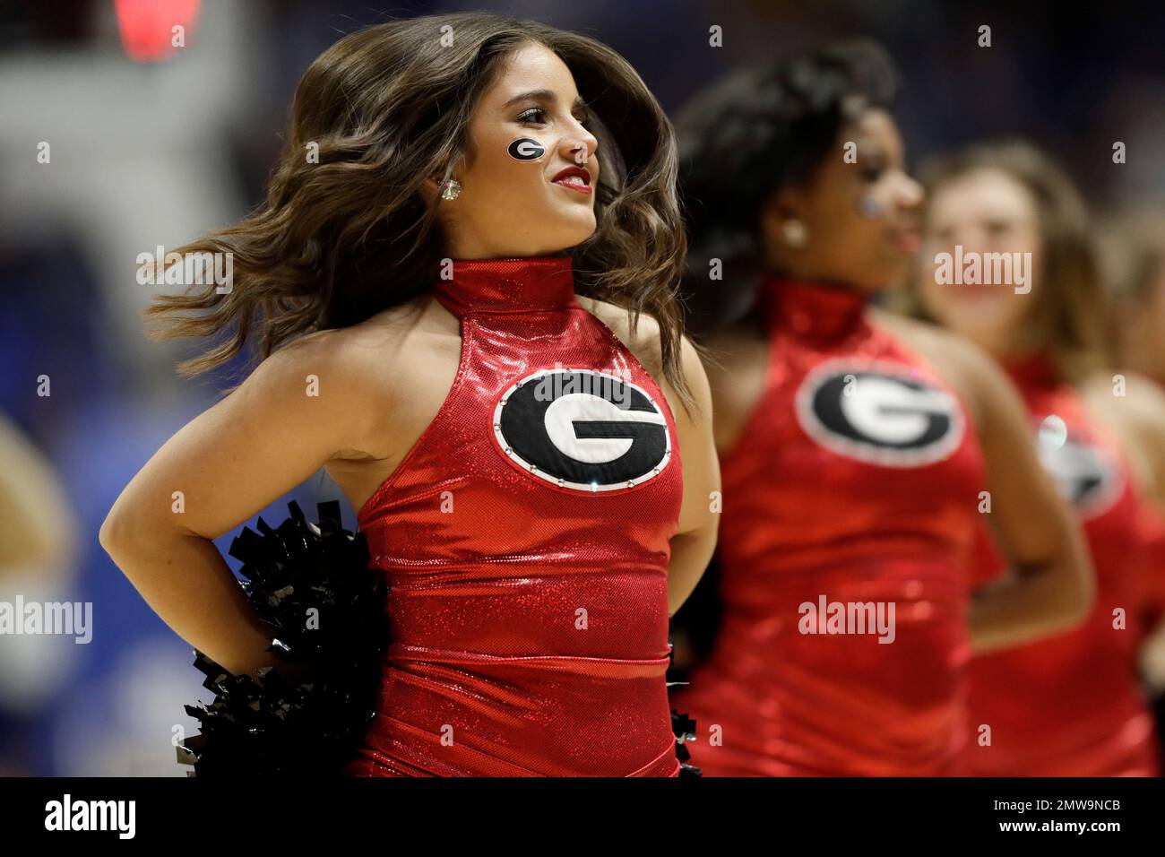 Georgia Cheerleaders Perform During The First Half Of An Ncaa College Basketball Game Between